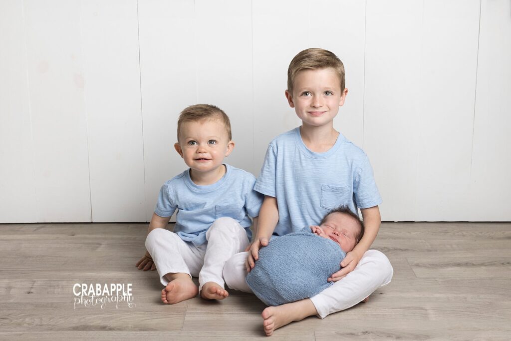 Beachy Newborn Photos with Brothers · Crabapple Photography